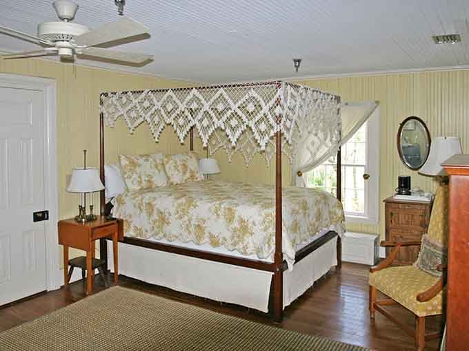 A four-poster canopy bed inside a historic lighthouse. Somewhere, a Nicholas Sparks editor just got very, very excited.