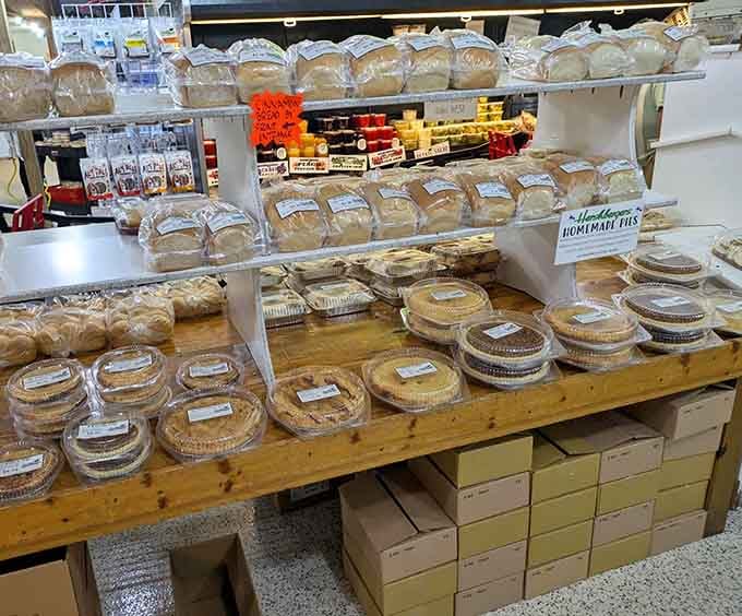 Loaves of fresh bread stacked high beside rows of homemade pies &mdash; this wooden display table is doing the Lord's work.