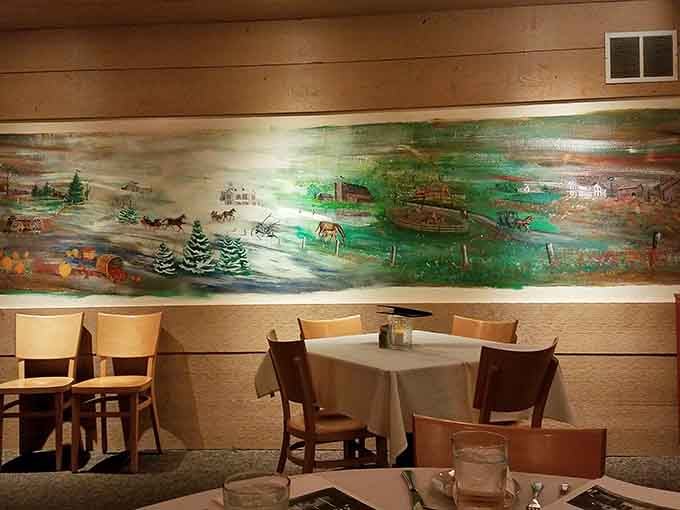 A sweeping hand-painted mural of Indiana countryside life stretches across the wall. History and dinner, served together.