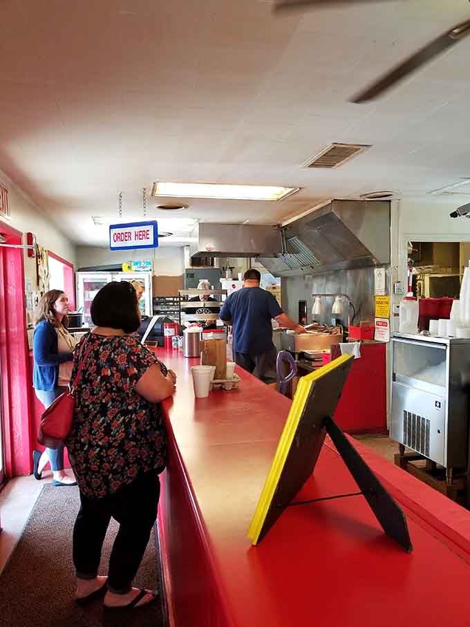 Step up to that red counter, place your order, and let the magic begin. Simple as that.