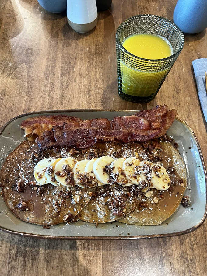Banana pecan pancakes with crispy bacon, the kind of breakfast that makes you cancel all your morning plans immediately.