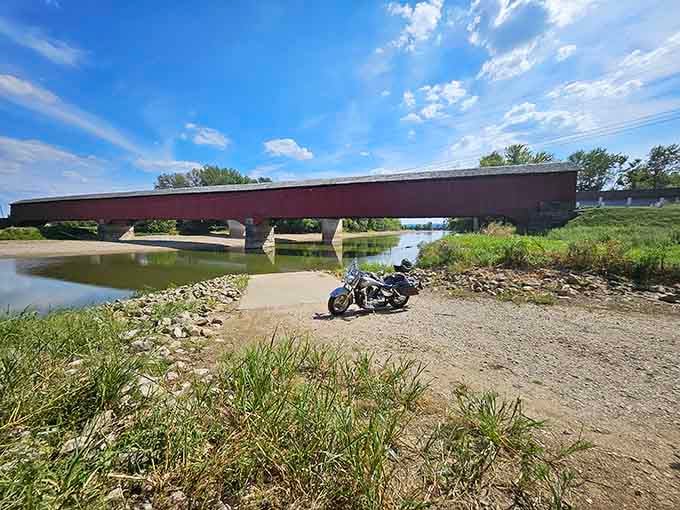 A parked motorcycle beside this river crossing proves that some destinations are worth every mile of the ride.
