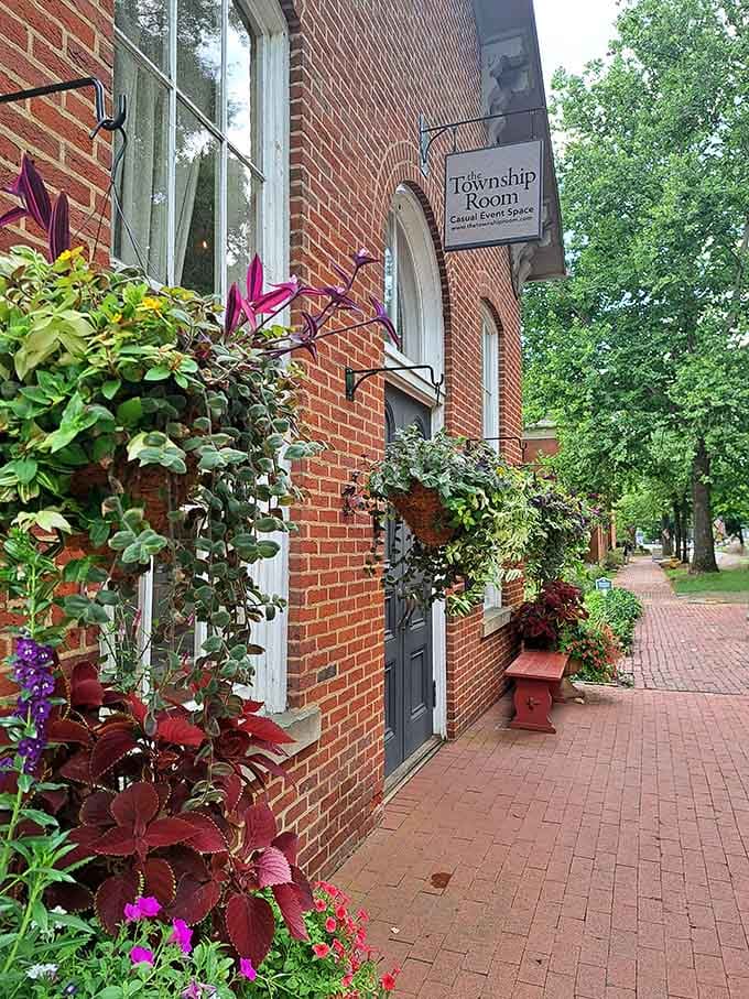 Cascading coleus and climbing vines frame the Township Room entrance like nature decided to handle the decorating herself.