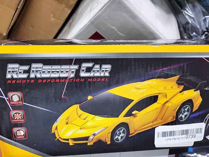 A remote control robot car buried in the bins, proof that Hylton's is basically a kid's birthday party waiting to happen.
