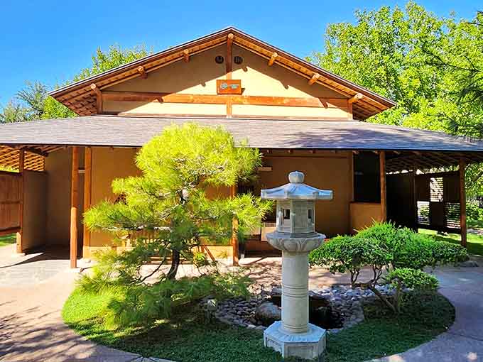 A traditional teahouse, a sculpted pine, and a stone lantern standing guard. This little corner means serious, beautiful business.
