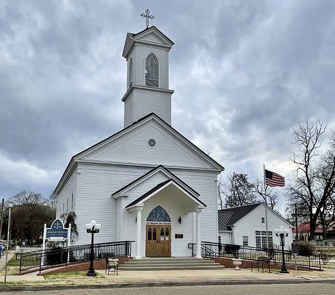 Immaculate Conception Church stands tall against a dramatic East Texas sky, a reminder that some things are built to last forever.