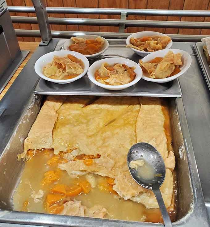 Peach cobbler served in little bowls, golden crust floating over sweet fruit. Pure Southern dessert poetry, no translation needed.