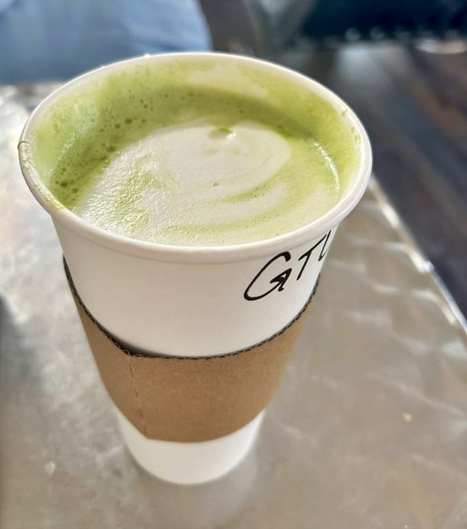 Vibrant green matcha latte that's as Instagram-worthy as it is delicious, served in a to-go cup for convenience.
