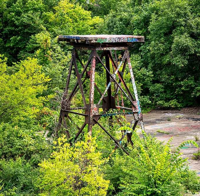 This weathered tower rises like a monument to Kansas City's industrial past, now wrapped in colorful graffiti.