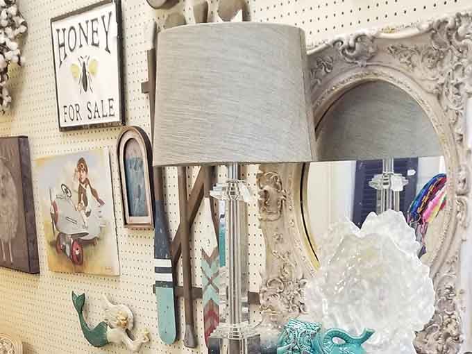 A crystal lamp, an ornate mirror, and a mermaid hook walk into a booth and somehow it works.