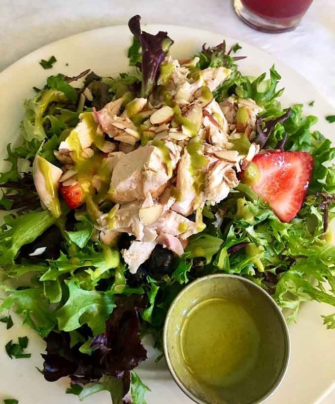 Fresh greens, chicken, berries, and almonds prove that salads here aren't sad afterthoughts but actual composed masterpieces worth ordering.