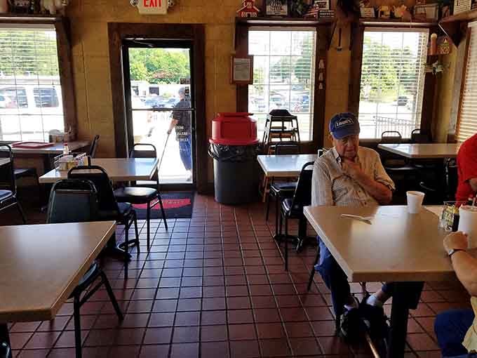 Rustic charm meets practical comfort in this cozy space where strangers become friends over coffee refills.