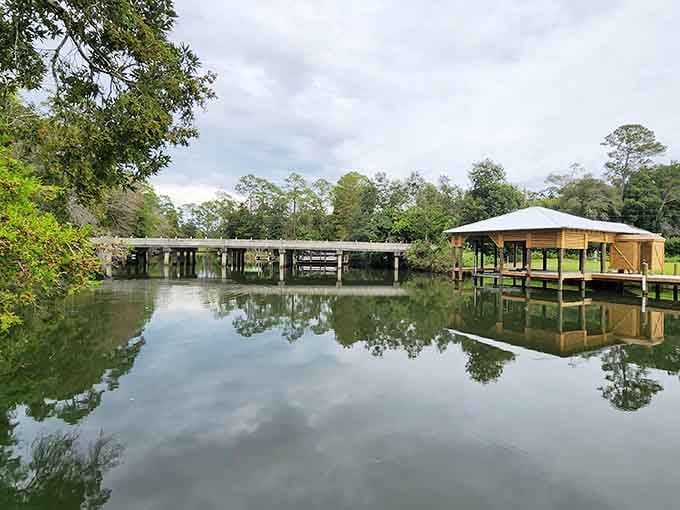 Still water, a wooden dock, and a covered boathouse. The Magnolia River doesn't rush for anyone.