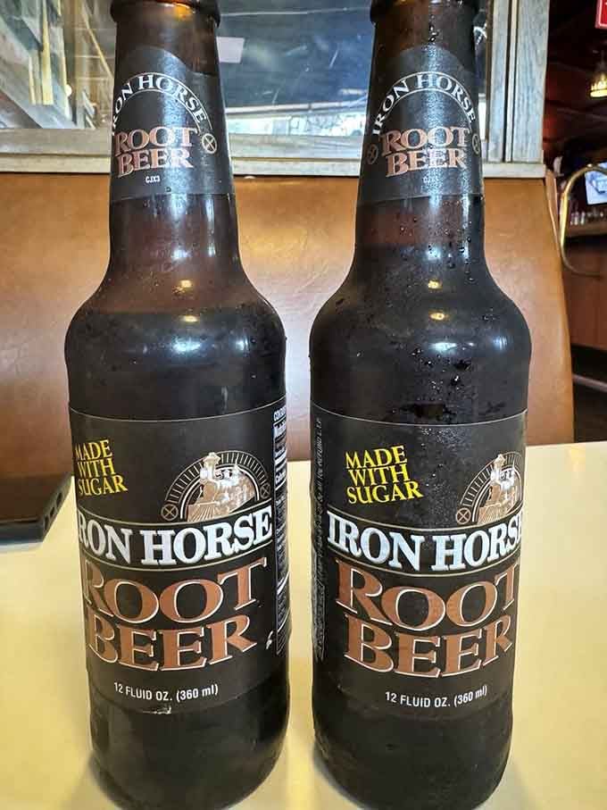 Two bottles of Iron Horse Root Beer sitting side by side, made with real sugar and ready to make your meal feel like a celebration.