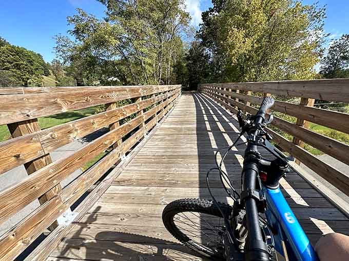 A mountain bike on a wooden bridge with nothing but open trail ahead. This is what a good Saturday looks like.
