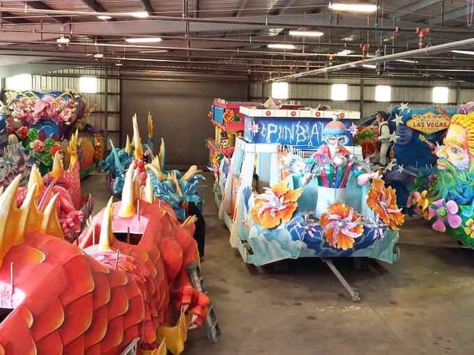 Rows of parade floats waiting in storage look like the world's most spectacular surprise party, just not yet assembled.