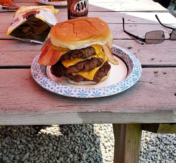This triple bacon burger towers with ambition and delivers on every level—literally three levels of beefy bliss.