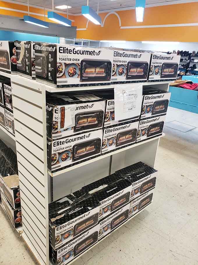 A whole display dedicated to Elite Gourmet toaster ovens, stacked so neatly it almost feels like a shrine to breakfast.