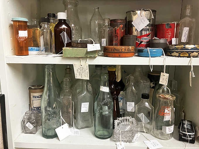 Old glass bottles and vintage tins lined up like quiet little time capsules, each one with a story nobody wrote down.