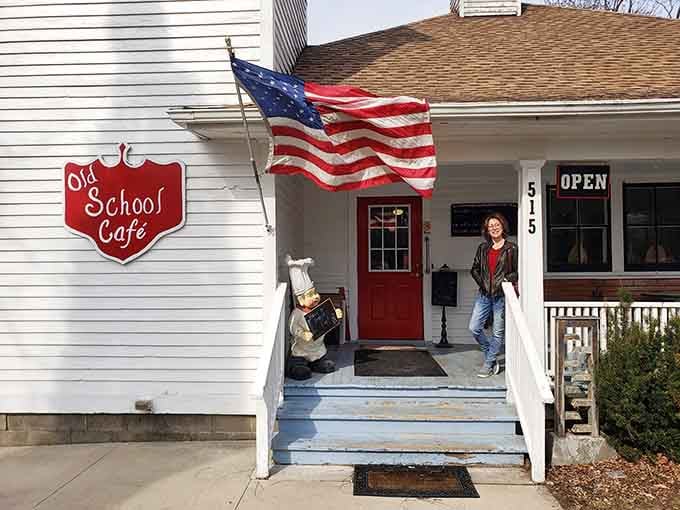 The red door, the flag, and a warm welcome. Old School Cafe's entrance sets the tone before you even step inside.