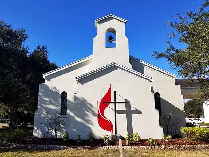 Community United Methodist Church's classic white facade offers spiritual refuge with distinctly Old Florida architectural charm and grace.
