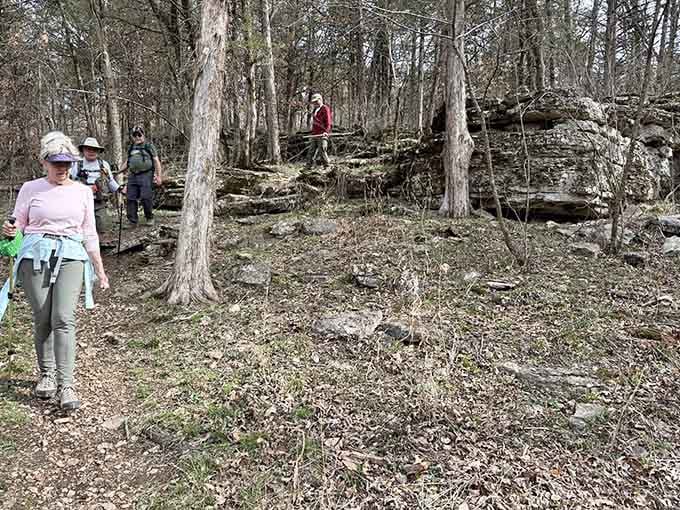 A group of hikers navigating rocky terrain together, proof that good trails bring good people out of the house.