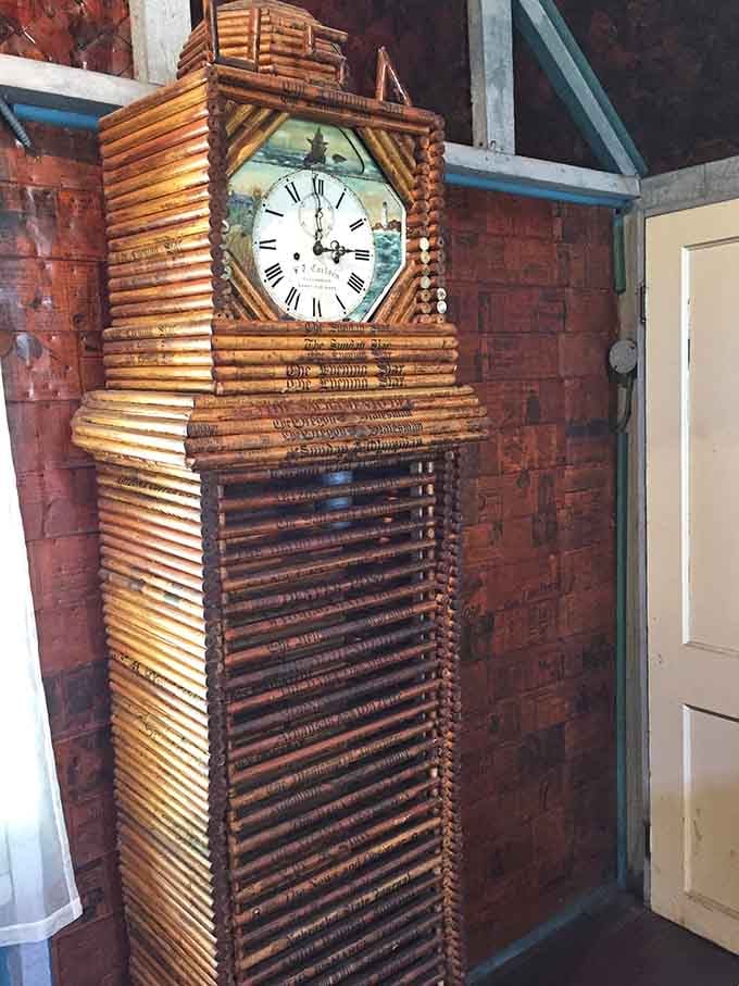 A grandfather clock built from rolled newspapers, still keeping watch over a room that defies every expectation you walked in with.