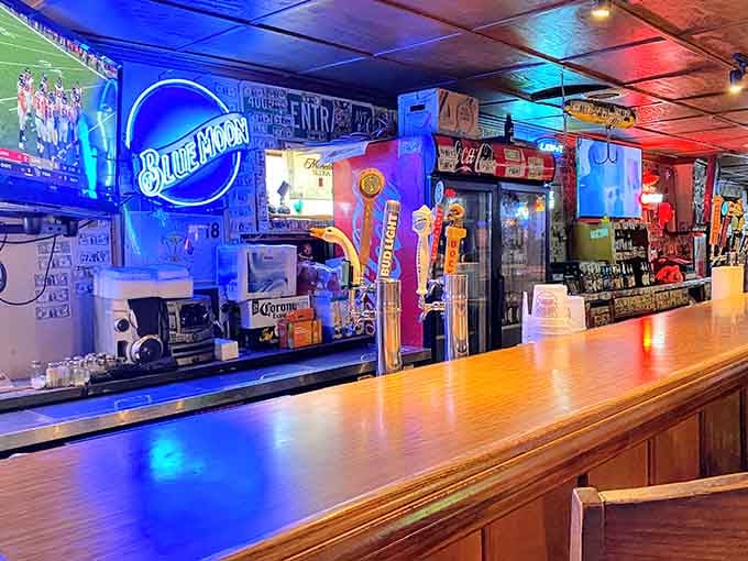 The bar glows with Blue Moon neon and draft taps, a welcoming beacon for anyone who's earned a cold one.