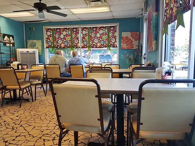 Teal walls, floral window shades, and ceiling fans spinning overhead. Pearly's has a warmth that no interior designer could ever manufacture or replicate.