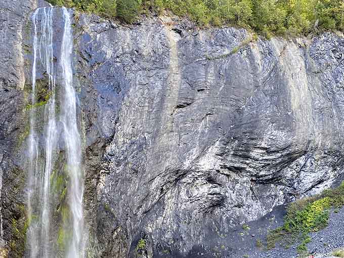 The layered rock beside Peewee Falls tells a geological story that makes human history feel remarkably brief.