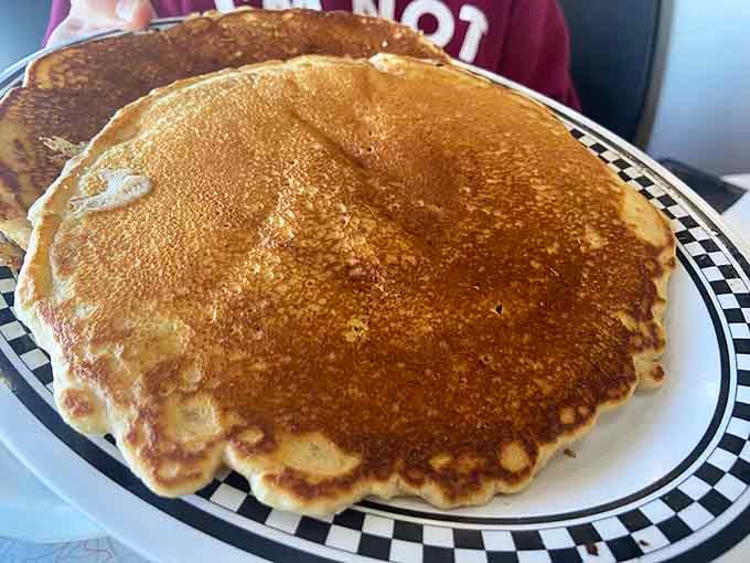 Pancakes so wide they're practically auditioning for their own zip code. Fluffy, golden, and absolutely glorious.