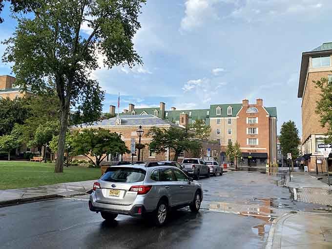 Tree-lined streets where colonial buildings and modern cars coexist like they've been roommates for centuries without complaint.