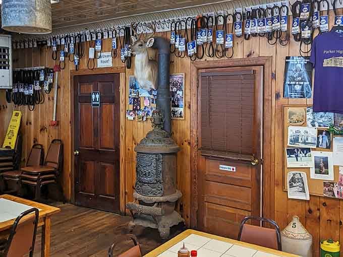 An old cast iron stove, a deer mount, and decades of memories pinned right to the walls.