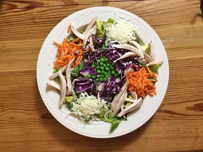A colorful salad proving that Red Shanty handles fresh vegetables with the same care as its smoked meats.