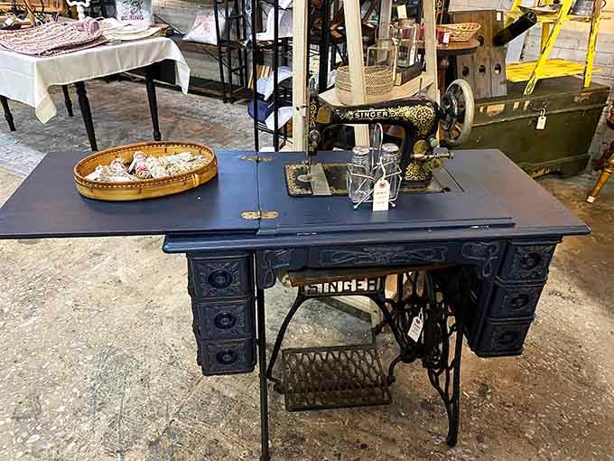 This vintage Singer sewing machine has more personality in its cast iron legs than most modern furniture has anywhere.