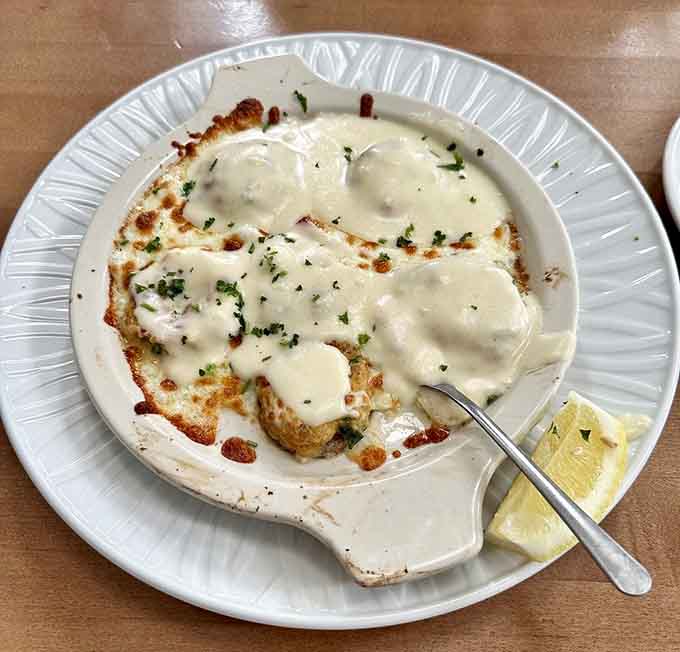 Crab stuffed mushrooms bubbling under a creamy sauce, the appetizer that steals the whole show.
