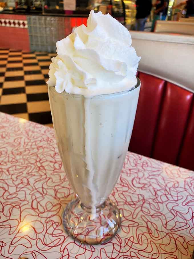 Tall, cold, and crowned with a mountain of whipped cream, this milkshake is a masterclass in simplicity.
