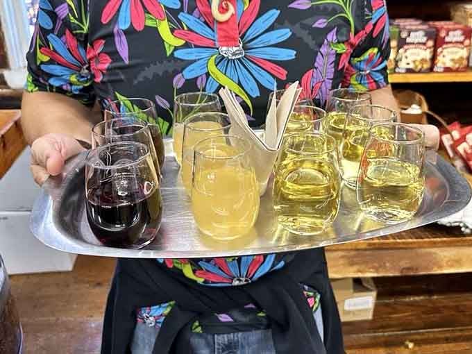A tray of fruit wines in every shade from pale gold to deep ruby, each one grown and made right here.