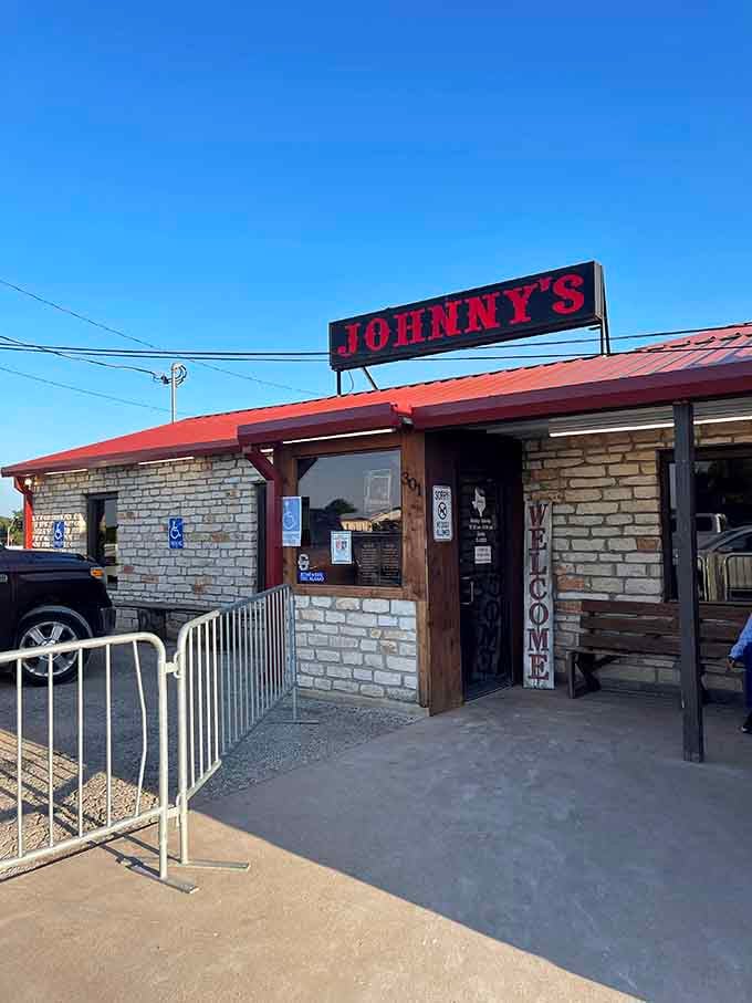 Johnny's limestone exterior and that bold red roof say one thing clearly: good food lives inside here.