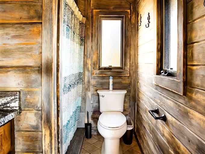 Even the bathroom has character here. Rustic wood walls make this the most charming restroom in the mountains.