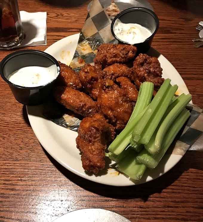 Saucy, sticky, and served with celery. These wings at Schuler's mean serious pub business.