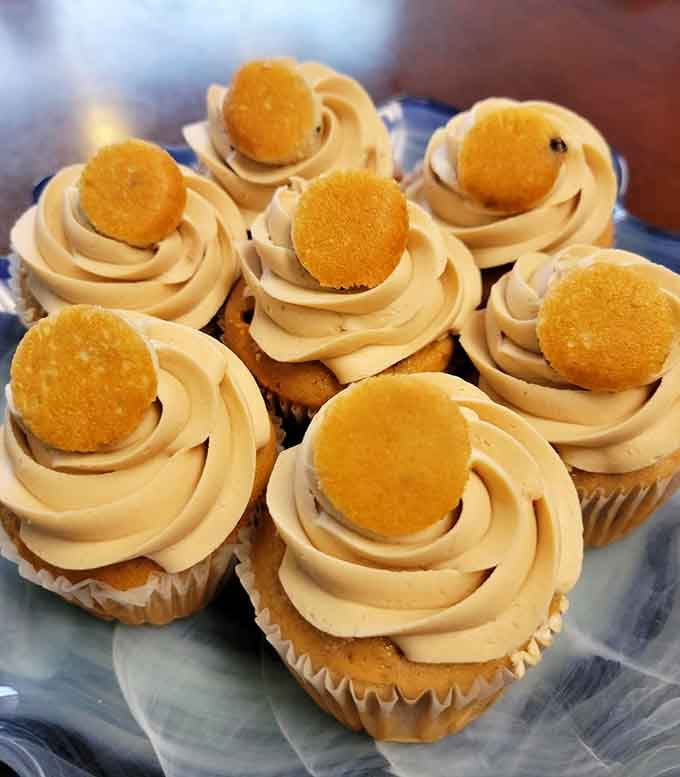 A golden cookie perched on swirled caramel frosting. The blueberry pancake cupcake is breakfast wearing its Sunday best.