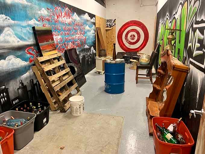 A bullseye on the wall, barrels of bottles ready to go, and graffiti that somehow makes it all feel like art.