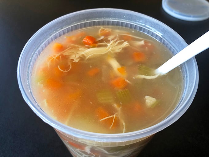 Golden broth, shredded chicken, tender carrots, and celery peeking through. Simple ingredients, serious soul, and a spoon already pointed in the right direction.