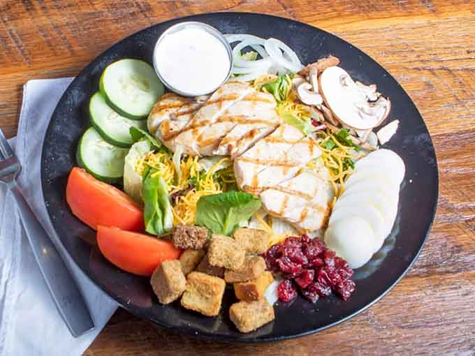 Even the salad here looks like it showed up to impress, grilled chicken and all the trimmings.