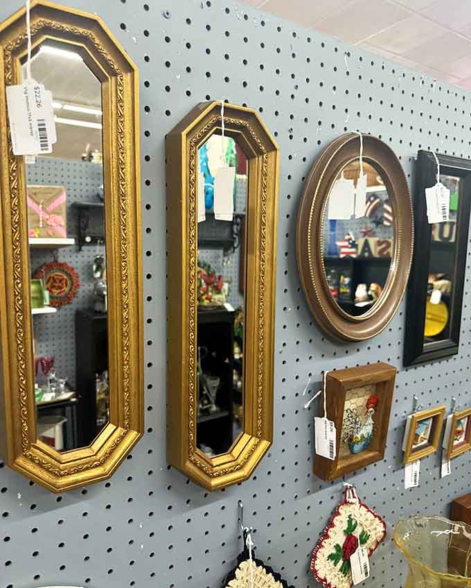 Gold-framed vintage mirrors that make every wall look like it belongs in a much fancier house than yours or mine.
