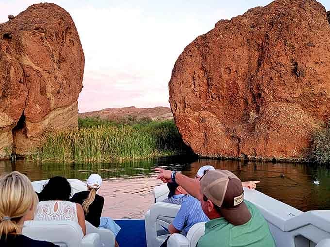 Massive copper-colored boulders rise from the water like nature decided to really make a point.