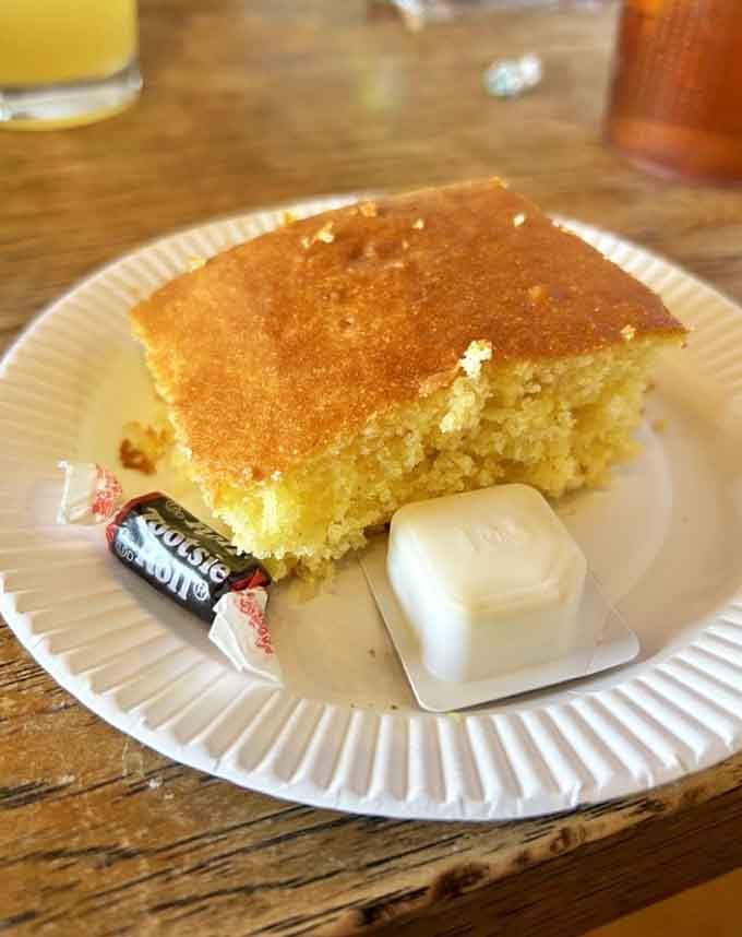 Golden cornbread, a pat of butter, and a Tootsie Roll on the side. Sweet Lucy's knows how to end a chapter.
