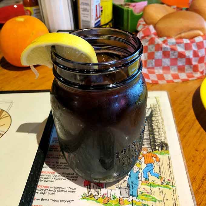 Iced tea in a mason jar with a fresh lemon wedge. Simple, cold, and absolutely perfect after a long mountain drive.