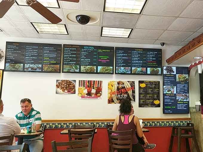 Real people enjoying real food in a real restaurant, no pretense required for this authentic experience.